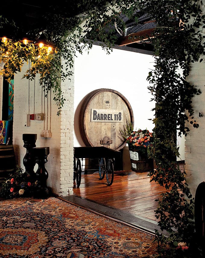 Barrel 118's enchanting entrance feels like discovering a secret garden, where vines frame wooden barrels and promise memorable evenings ahead.