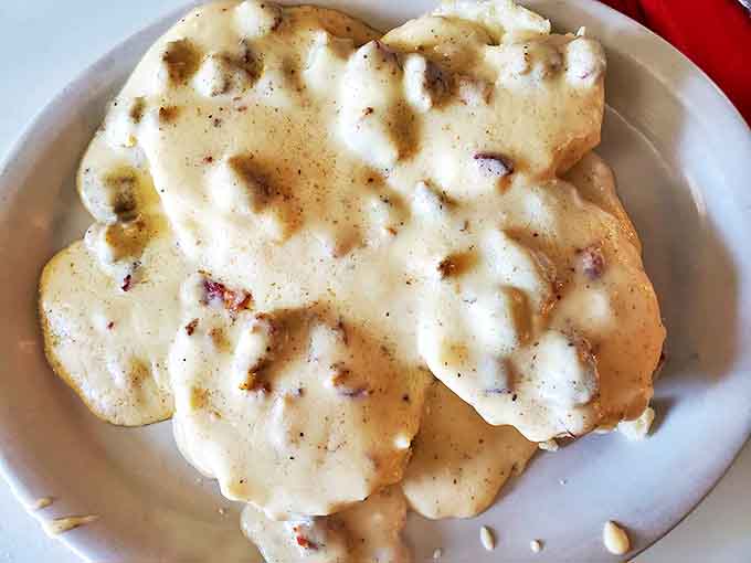 Biscuits and gravy – the comfort food equivalent of a warm hug from your grandmother, smothered in peppery goodness.