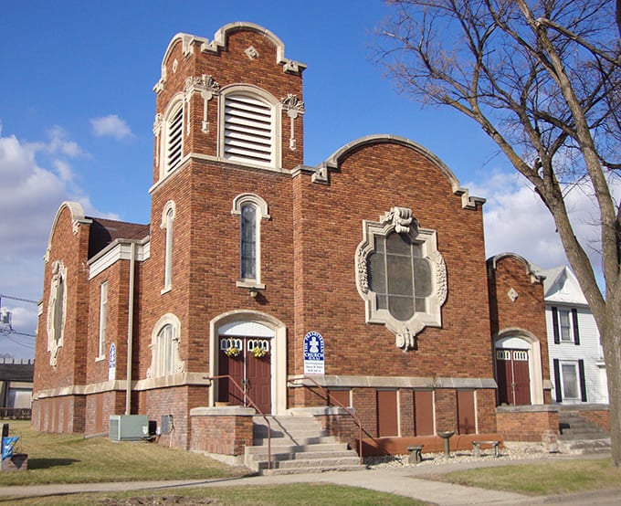 This beautiful brick church stands as a community cornerstone, offering spiritual wealth without demanding financial sacrifice.