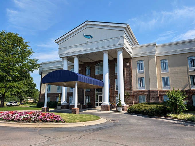 The Coldwater Inn combines Southern hospitality with modern comforts. Those white columns say "antebellum elegance" while the parking lot says "but we have Wi-Fi."