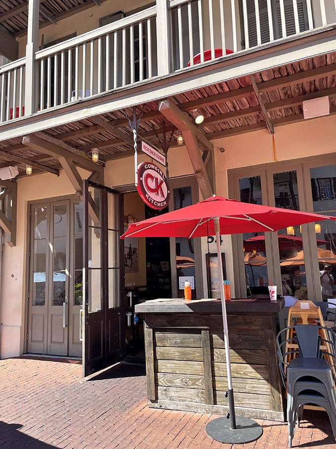 Cowgirl Kitchen's inviting facade and outdoor seating beckon hungry beachgoers with promises of casual fare worth taking a break from the waves.