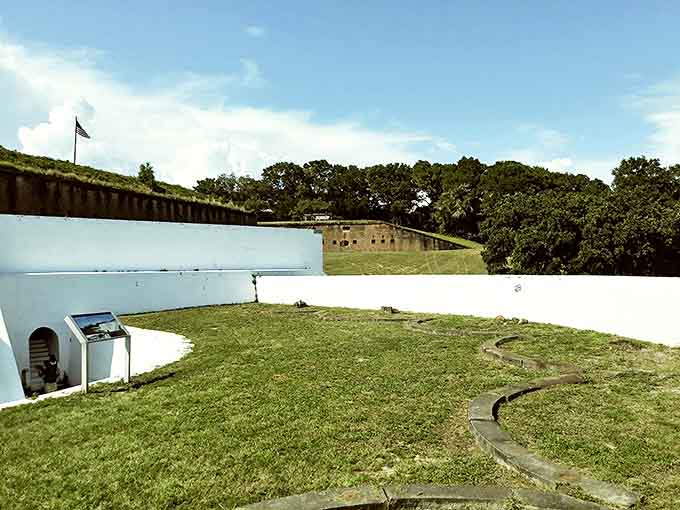 Fort Barrancas reveals layers of history within its whitewashed walls, where military ingenuity meets architectural beauty in a surprisingly peaceful setting.
