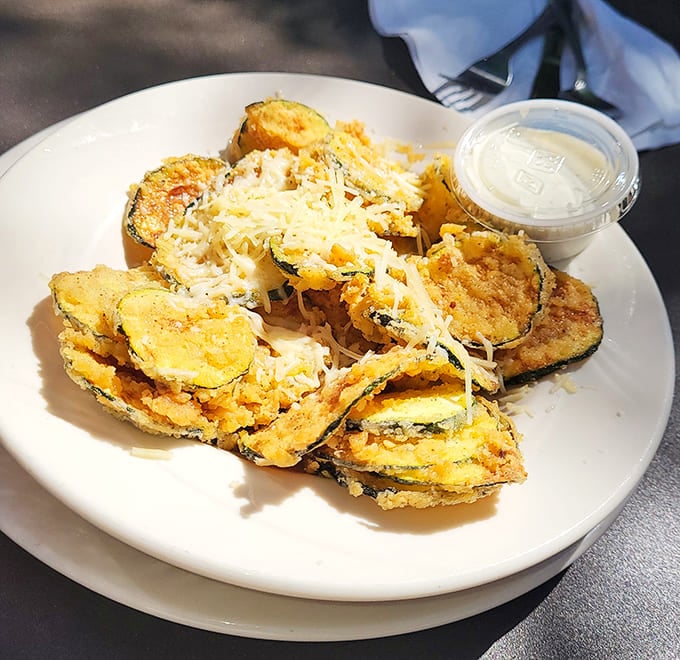 Fried zucchini that transforms garden vegetables into crispy, cheese-topped morsels that even vegetable skeptics can't resist.