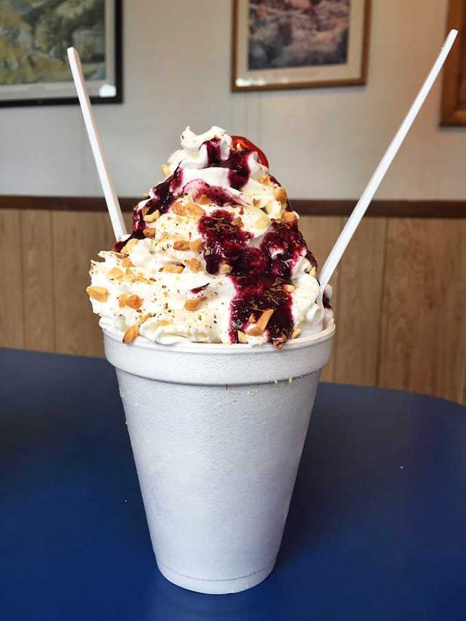 The Huckleberry Sundae towers like a snow-capped Idaho mountain, with berry sauce cascading down whipped cream slopes&mdash;a dessert with a view.