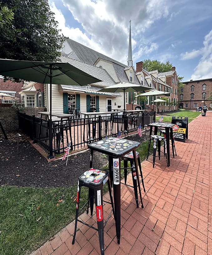 The outdoor seating area, complete with umbrella-shaded tables, transforms an ordinary coffee run into an al fresco experience worthy of a European caf&eacute;.