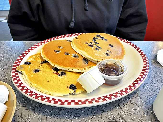 Blueberry pancakes that don't just have berries&mdash;they celebrate them. The maple syrup is just waiting for its moment to shine.