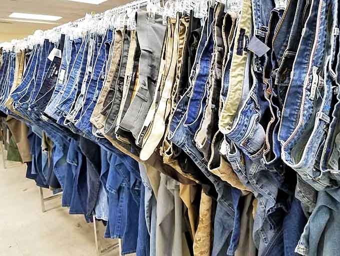 The wall of denim possibilities where every pair tells a different story. From dad jeans to designer cuts, your next favorite pants are hanging right here.