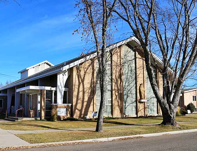 This modern church building bridges faith and community in Carrington, its clean lines and large windows bringing light to both spiritual and social gatherings.