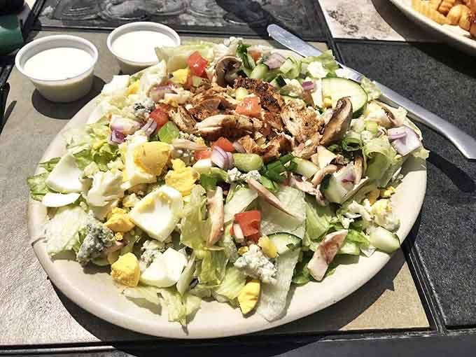 A salad that doesn't apologize for being healthy. Fresh ingredients arranged with care, proving that not everything delicious at a pub needs to be fried.