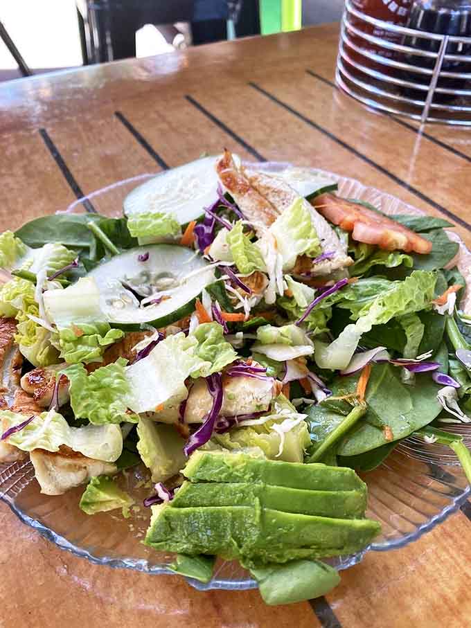 A salad that doesn't apologize for being a salad. Those avocado slices are the green gems in a crown of freshness.