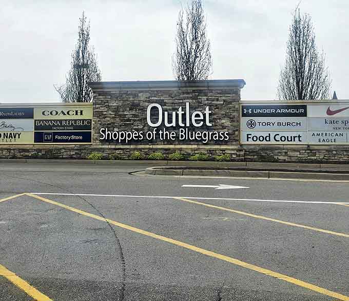 The stone entrance sign announces your arrival at the promised land of discounts. Prepare your wallet for a workout.