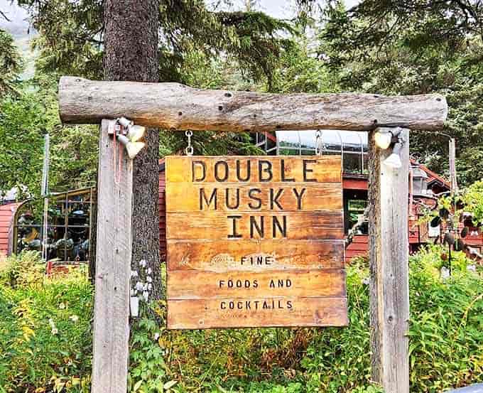 The rustic wooden sign stands as a humble gatekeeper to culinary greatness&mdash;"Fine Foods and Cocktails" might be the understatement of the century.