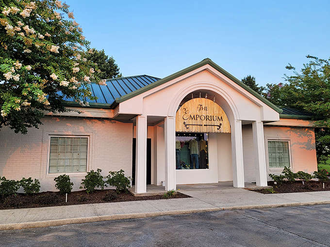 The Emporium's elegant columns and soft pink exterior house local treasures, offering a shopping experience that big-box retailers simply can't replicate.