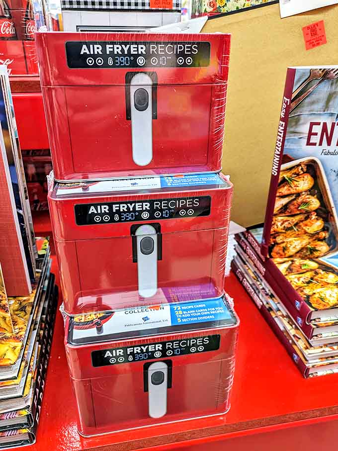 Air fryer cookbooks stacked like the culinary answer to all your "I should eat healthier but still want it to taste good" prayers.