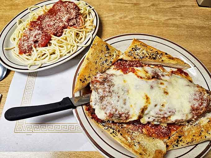 Italian-American diner magic at its finest! This chicken parmesan with its melty cheese blanket and side of spaghetti proves that sometimes the classics just can't be improved upon.