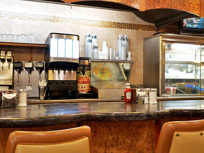 The counter&mdash;where solo diners find community, coffee gets endless refills, and you can watch short-order magic happen in real time.