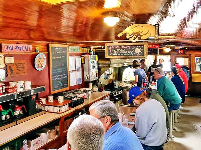 The merch wall proves Frank's isn't just a place to eat – it's an institution worthy of wearing its logo proudly across your chest.