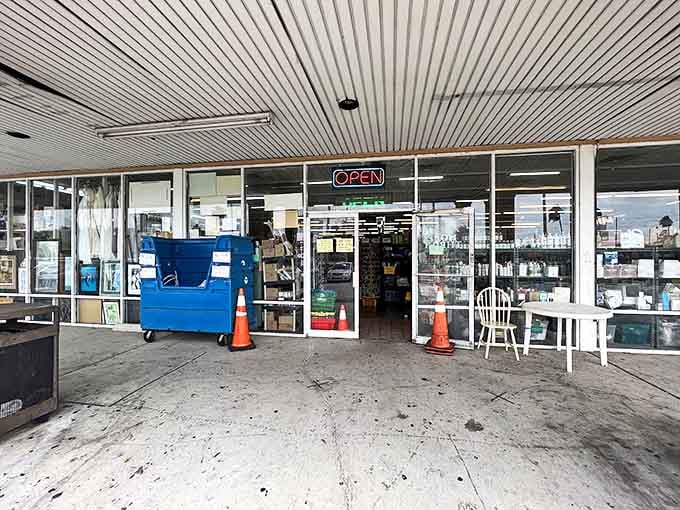 The portal to possibility. Two orange cones guard the entrance to a world where yesterday's discards become tomorrow's treasures.