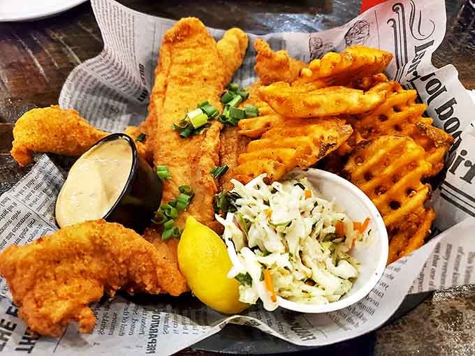 Golden-fried fish that shatters at first bite, paired with waffle fries that make regular fries seem like they're not even trying.