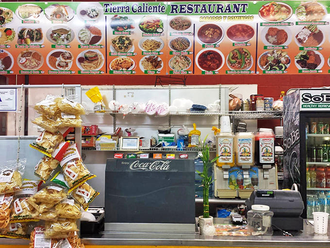 Tierra Caliente's menu board promises authentic flavors that fuel serious shopping expeditions. The chicharrones alone are worth the trip.