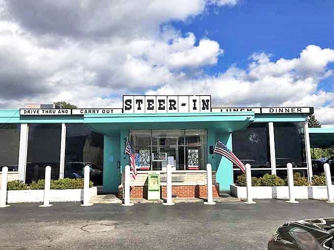 American flags flank the entrance, promising patriotic portions and the kind of hospitality that makes strangers feel like regulars.
