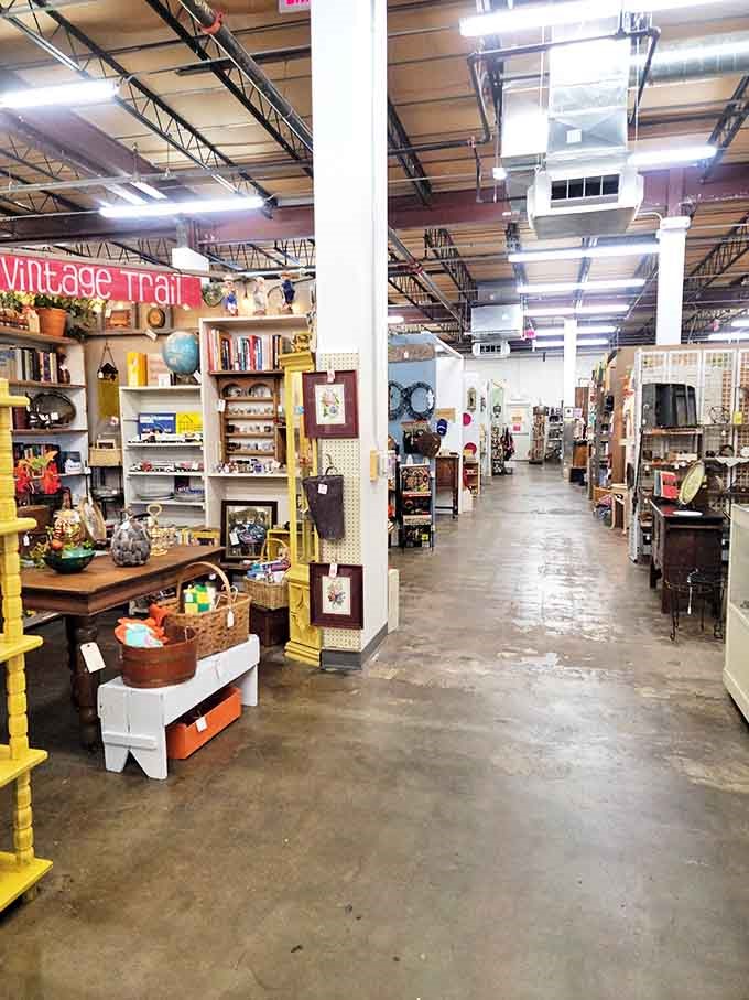 The industrial ceiling may say "warehouse," but the treasures below whisper stories of dinner parties, family gatherings, and decades of American life.
