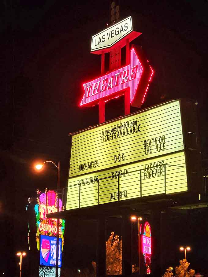 The marquee glows with current blockbusters, proving this isn't just a novelty but a thriving cinema. "Death on the Nile" looks better under stars.