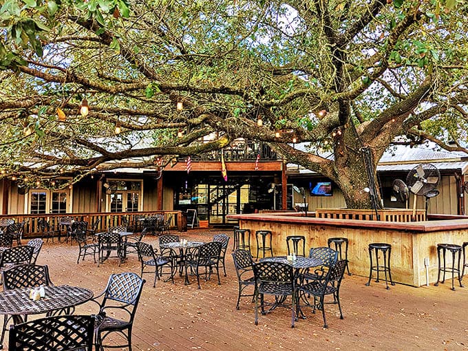 The outdoor seating area beneath a majestic oak tree offers nature's air conditioning&mdash;dining as it was meant to be in Louisiana.