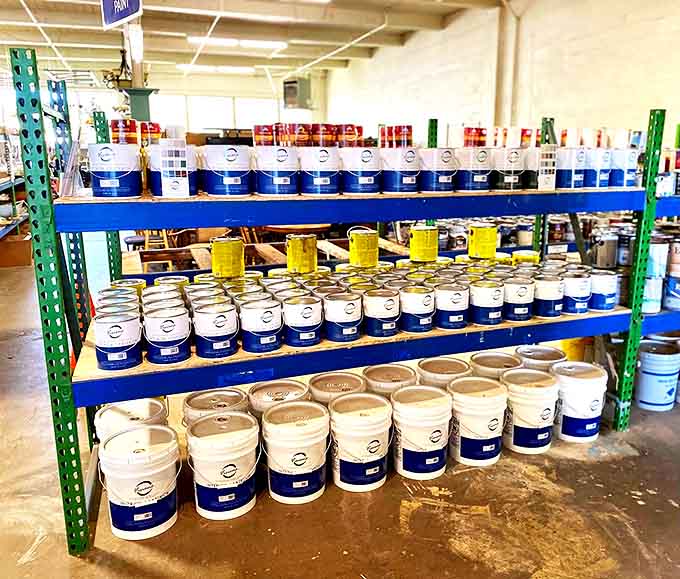 The paint section: where your living room's future personality crisis waits in neatly stacked buckets of possibility.