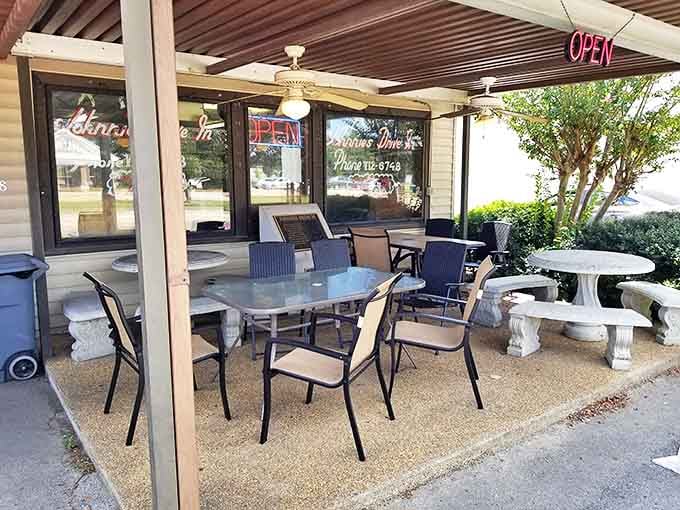 The outdoor patio where summer evenings stretch into sweet memories. Simple tables, ceiling fans, and conversations that linger like the Mississippi heat.
