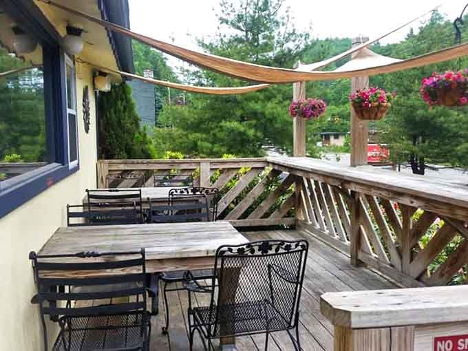 The outdoor patio—where mountain air seasons your breakfast and hanging baskets of flowers provide the perfect backdrop for morning conversations.