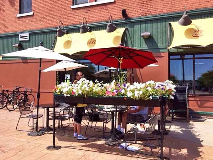 Outdoor dining that makes Minnesota summers even more precious. Those flowers aren't just decorative&mdash;they're celebrating the joy of eating pancakes in sunshine.