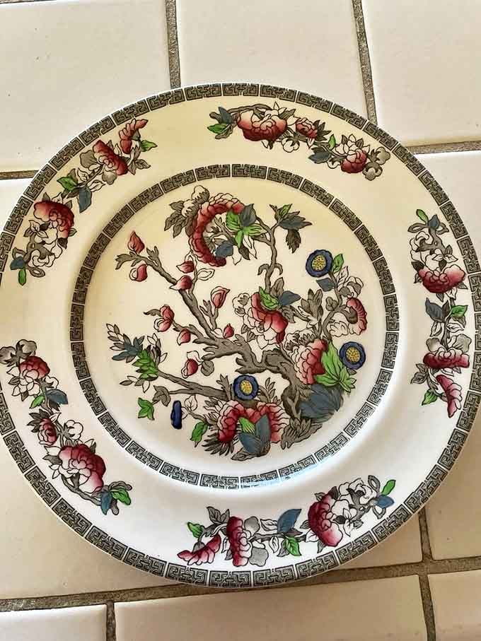 Delicate brushstrokes tell stories on fine china that survived generations. Someone's wedding gift becomes another's treasure hunt discovery.