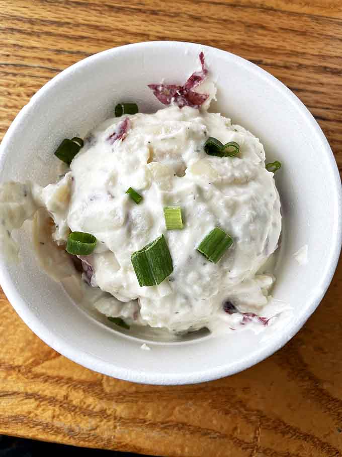 Potato salad that's achieved the perfect balance of creaminess and texture, with green onions adding little flavor exclamation points.
