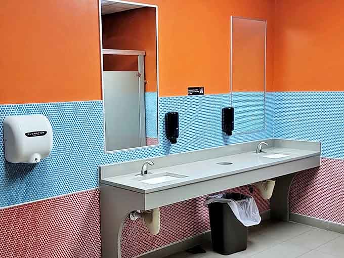 Even the restroom continues the diner's color story. Orange and blue: surprisingly soothing after that third cup of coffee.