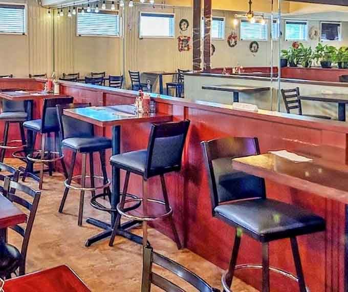 The counter seating offers prime real estate for solo diners or those who appreciate the choreographed ballet of a busy breakfast service. Front-row seats to morning magic.