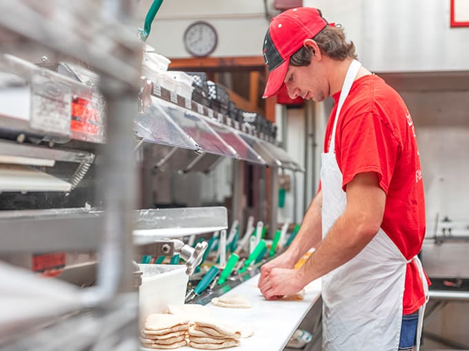Hands that have crafted thousands of pies move with the confidence of experience. Some skills can't be taught, only earned through repetition.
