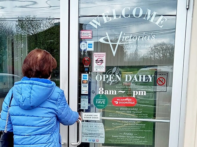 The door promises "OPEN DAILY"—two beautiful words that rival "free dessert" in their ability to warm the heart of any hungry traveler.