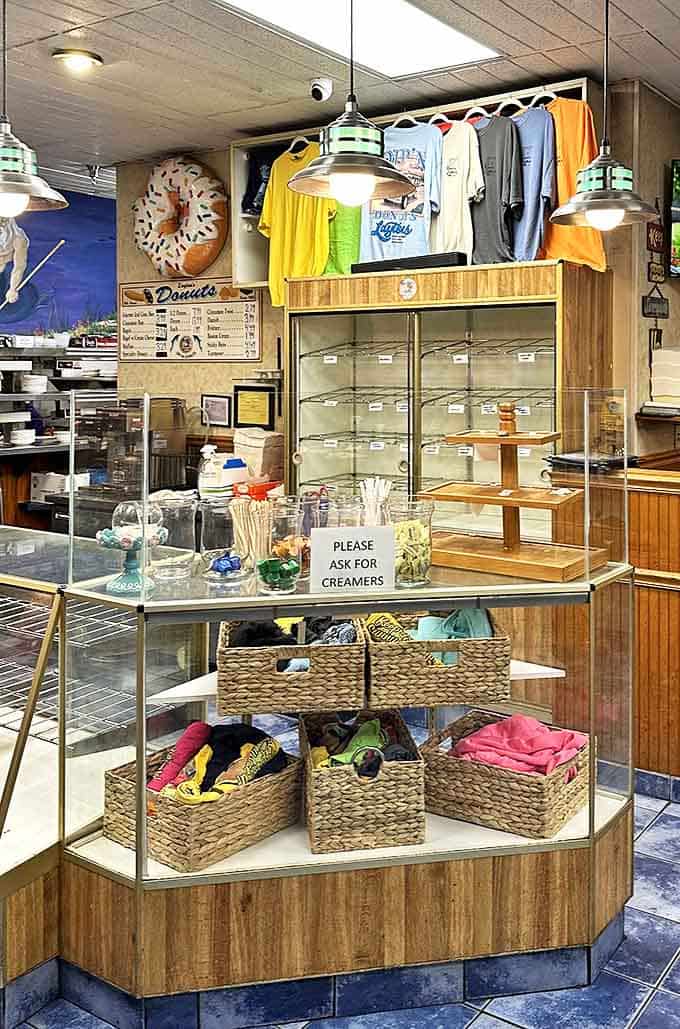 The donut wall of fame! T-shirts for sale and empty display cases suggest you've arrived too late &ndash; early birds get the donuts here.