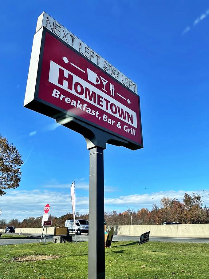 The roadside sign stands tall against Pennsylvania sky, proudly directing travelers to their next memorable meal.