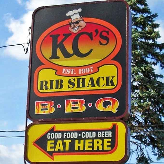 The sign promises exactly what you'll find inside: "GOOD FOOD • COLD BEER • EAT HERE." No false advertising in barbecue country.