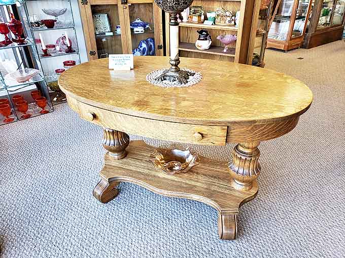 This tiger oak parlor table once hosted Victorian calling cards and afternoon tea&mdash;now it awaits a second life in your Pinterest-inspired space.