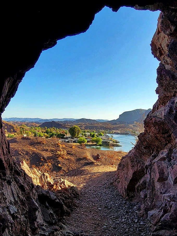 Framed by ancient rock, the view from this cave feels like peering through a portal to paradise. Nature's perfect picture window.