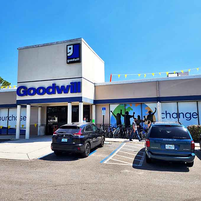 Goodwill's bright blue signage stands like a beacon of bargains under the Florida sun, promising treasures for the patient hunter.