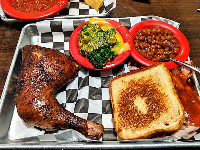 When a chicken has fulfilled its highest purpose. This smoke-ringed quarter bird with Texas toast and sides is comfort on a metal tray.