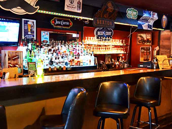 The well-stocked bar glows with promise, offering everything from local brews to cocktails that complement the menu's robust flavors perfectly.