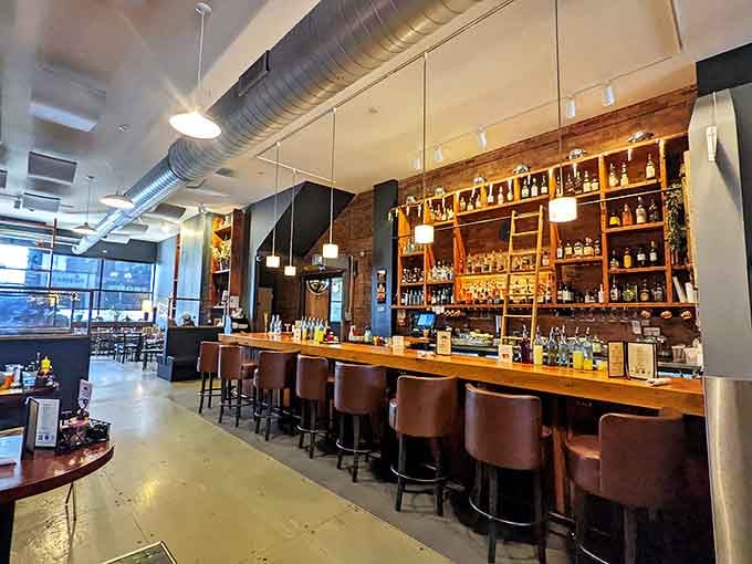 The bar area doesn't just serve drinks; it creates the perfect stage for bourbon and beer to perform their supporting roles in the barbecue symphony.