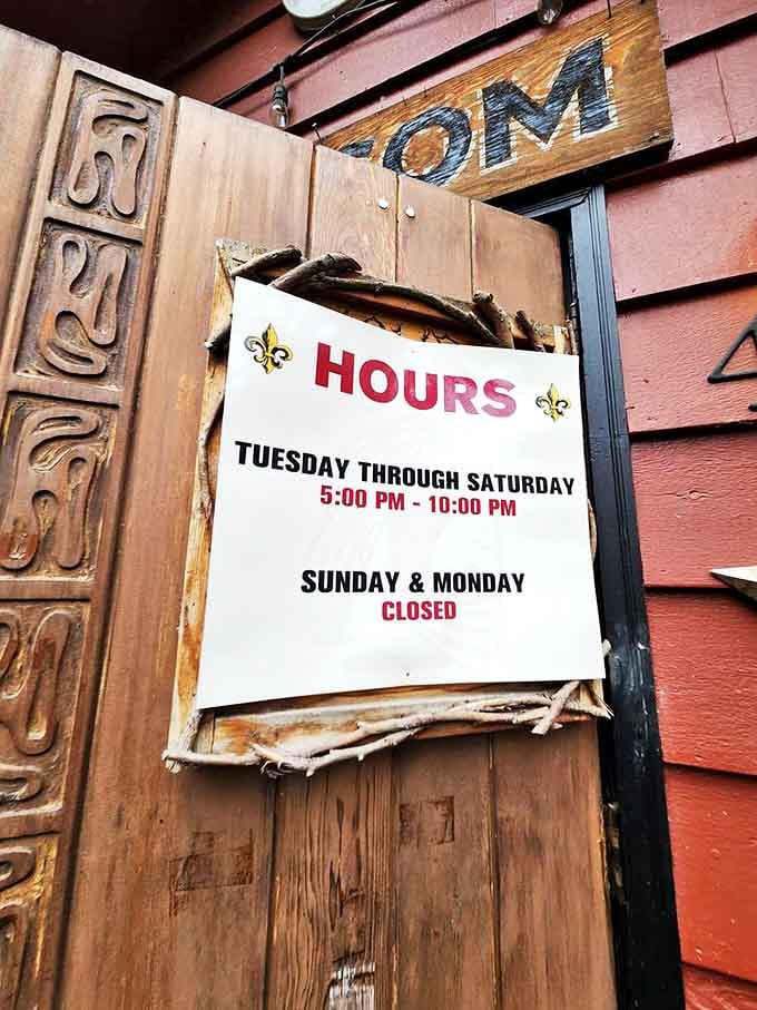 The hours posted on this weathered door might seem limited, but they're just long enough to change your definition of what great food can be.