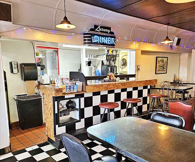 The beating heart of any great diner&mdash;a counter where coffee flows freely and stories are exchanged. Black and white tiles add a classic touch.
