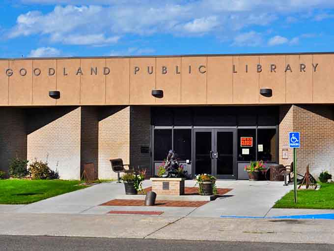 Goodland Public Library's welcoming entrance, adorned with flower pots, invites visitors to feed their minds in air-conditioned comfort.